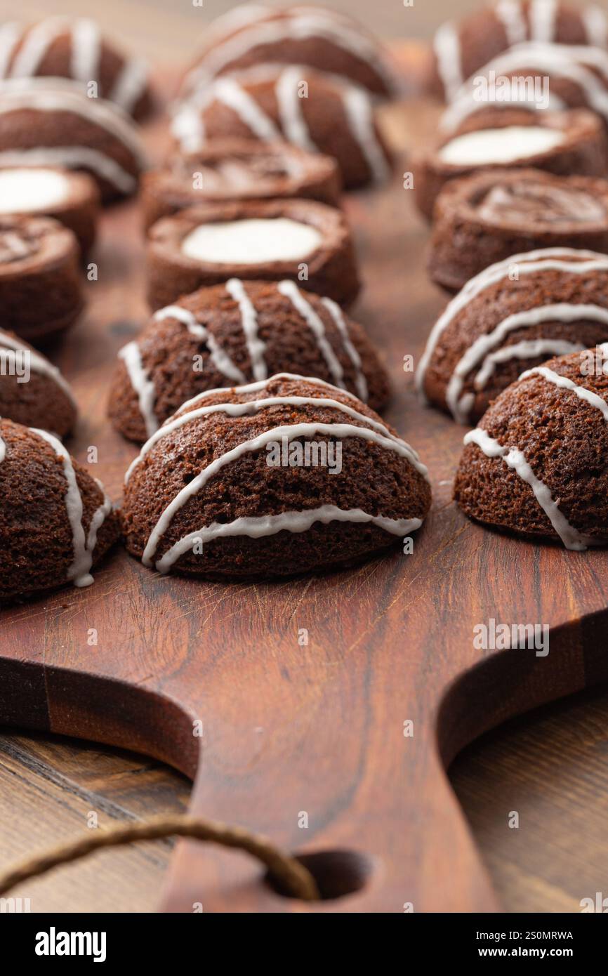 Baked goods: Round chocolate cookies with white glaze stripes. Ready to ...