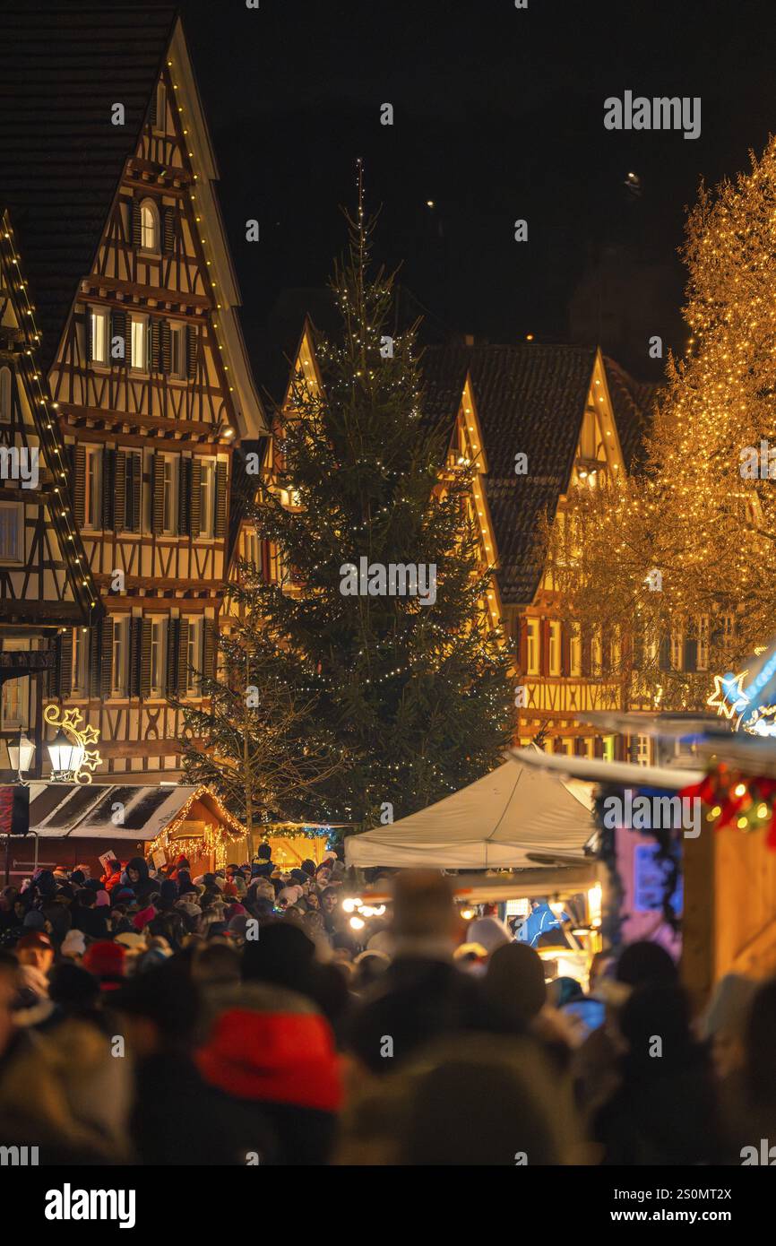 Illuminated Christmas market at night with half-timbered houses and ...
