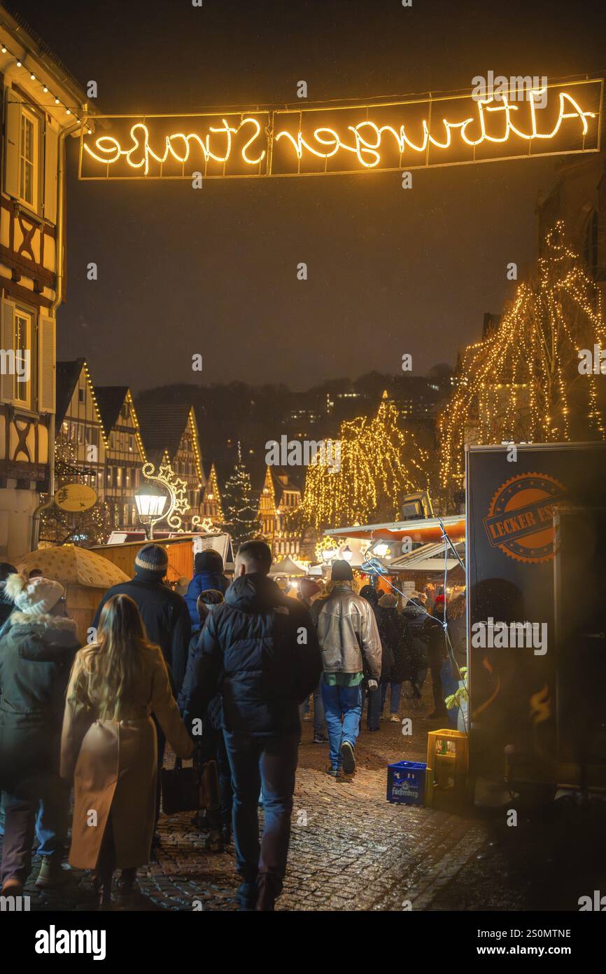 Festive Christmas market in the old town at night with illuminated ...