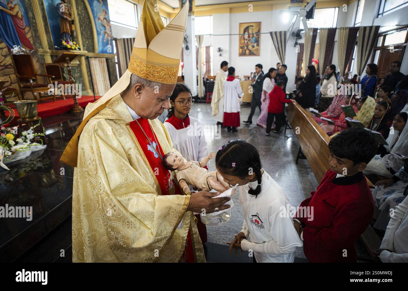 Archbishop John Moolachira holds an idol of baby Jesus Christ as ...