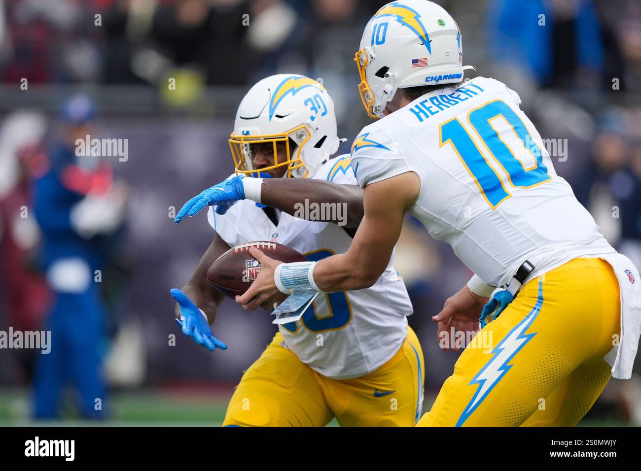 Los Angeles Chargers running back Kimani Vidal (30) takes a handoff ...