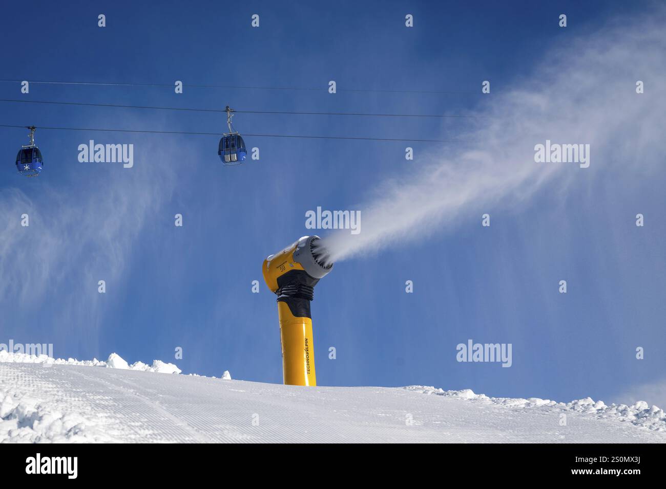 Snowmaking system and aerial cableway Stock Photo - Alamy
