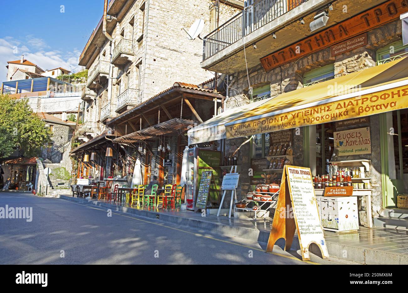 Main street in the morning in the mountain village of Langadia, Arcadia ...