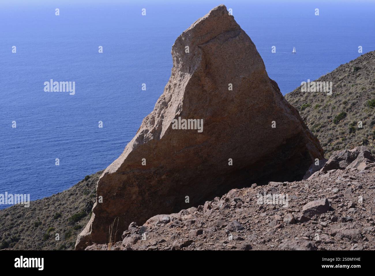 Singular pyramid-shaped rock, Cabo De Gata Nijar National Park ...