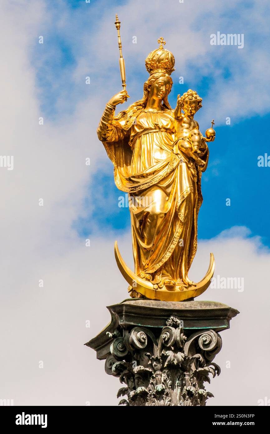 The golden Virgin Mary column in the Mariensaule main square, Munich ...