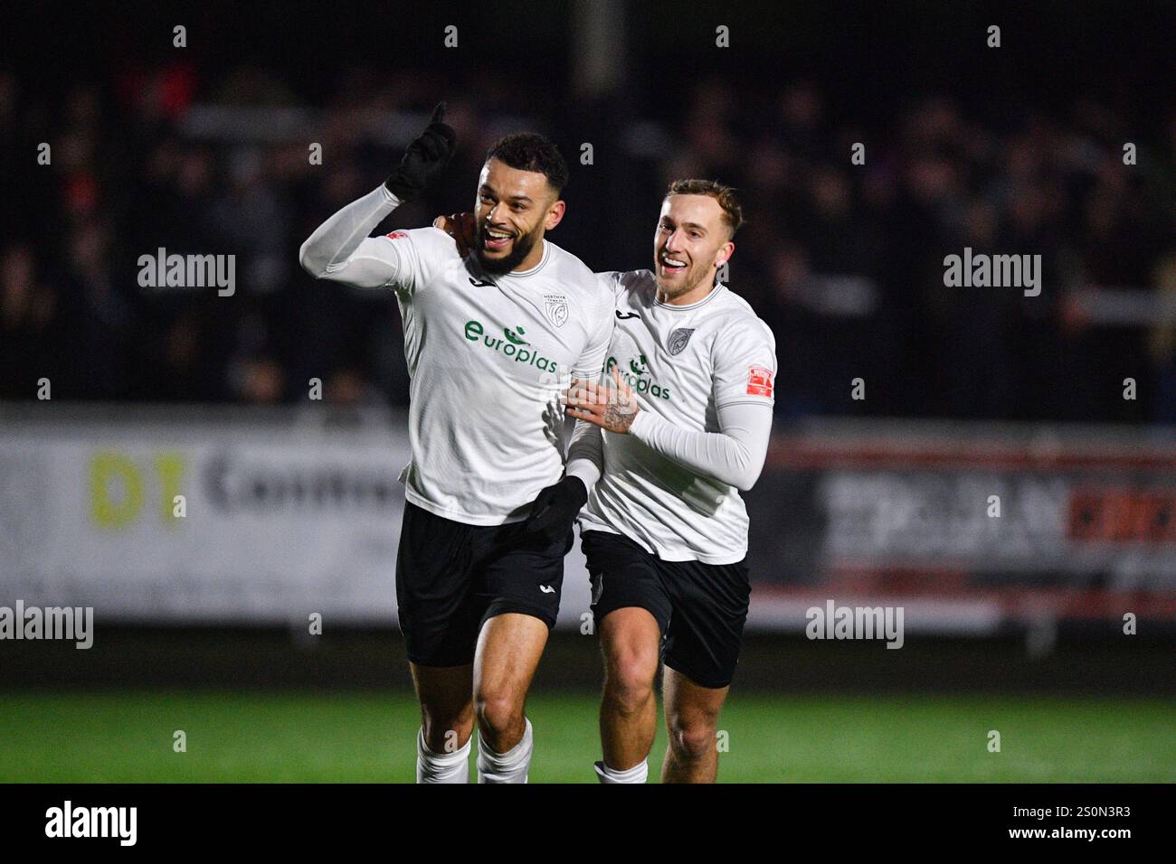 Kane Simpson of Merthyr Town (l) celebrates after he scores his teams ...