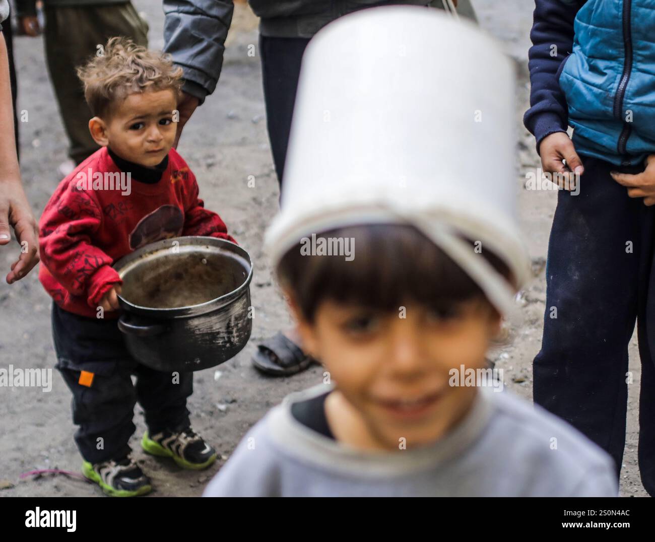 December 27, 2024, Gaza City, The Gaza Strip, Palestine: People try to ...