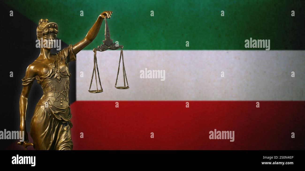 Close-up of a small bronze statuette of Lady Justice before a flag of ...