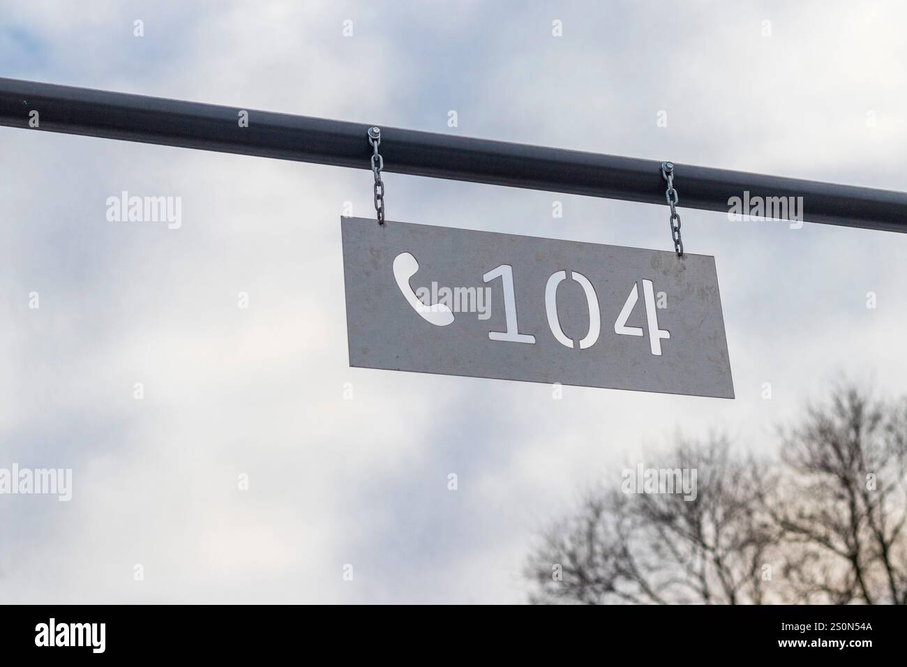 Metal plate with emergency number engraved in it Stock Photo - Alamy