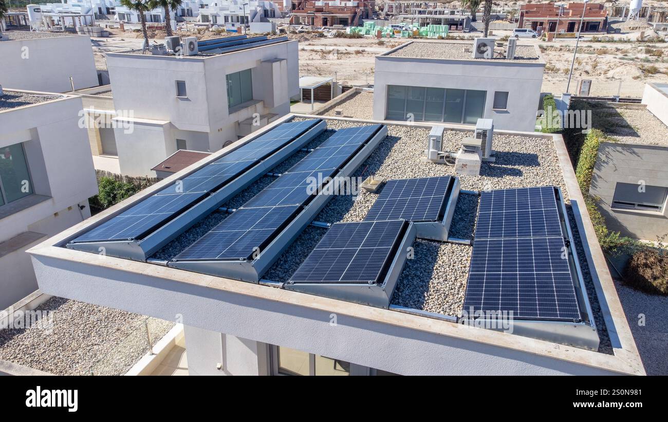 Energy-efficient rooftop with multiple solar panels installed on a ...