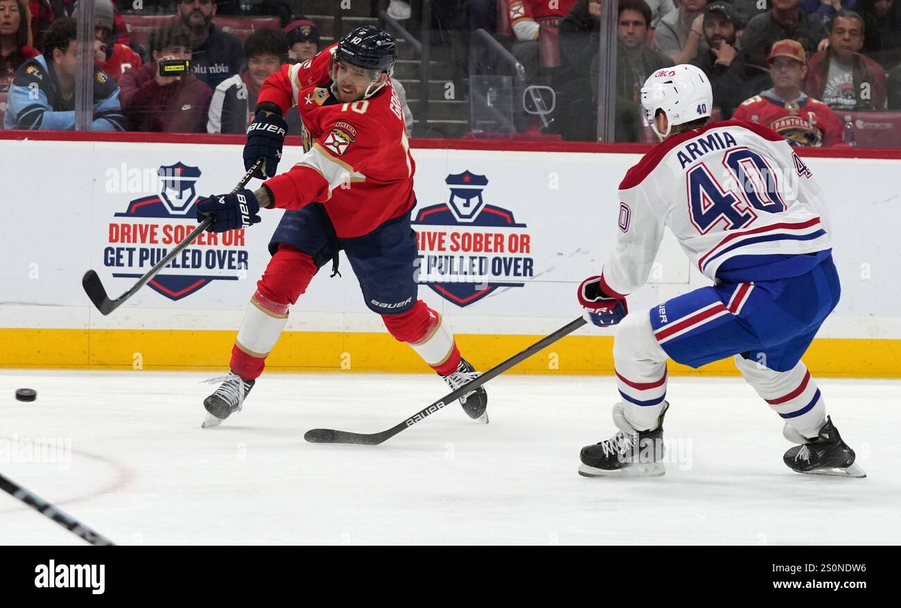 Florida Panthers left wing A.J. Greer (10) attempts a shot on the goal ...