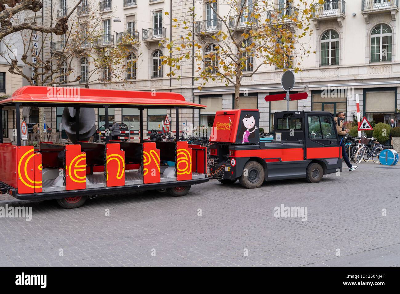 Geneva, Switzerland - December 10, 2024: Trolley train for tourists ...