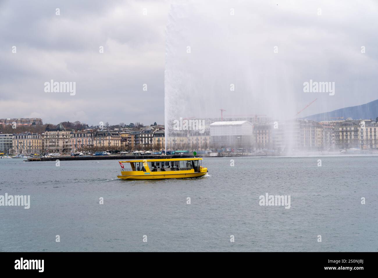 Geneva, Switzerland - December 10, 2024: Tourist boat floats by the ...