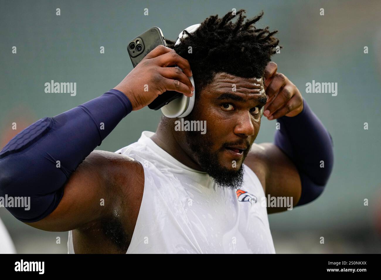 Denver Broncos defensive tackle Malcolm Roach (97) warms up before an ...