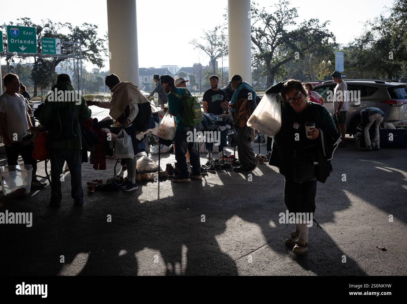 Tampa, Florida, USA. 28th Dec, 2024. Homeless men and women gather ...