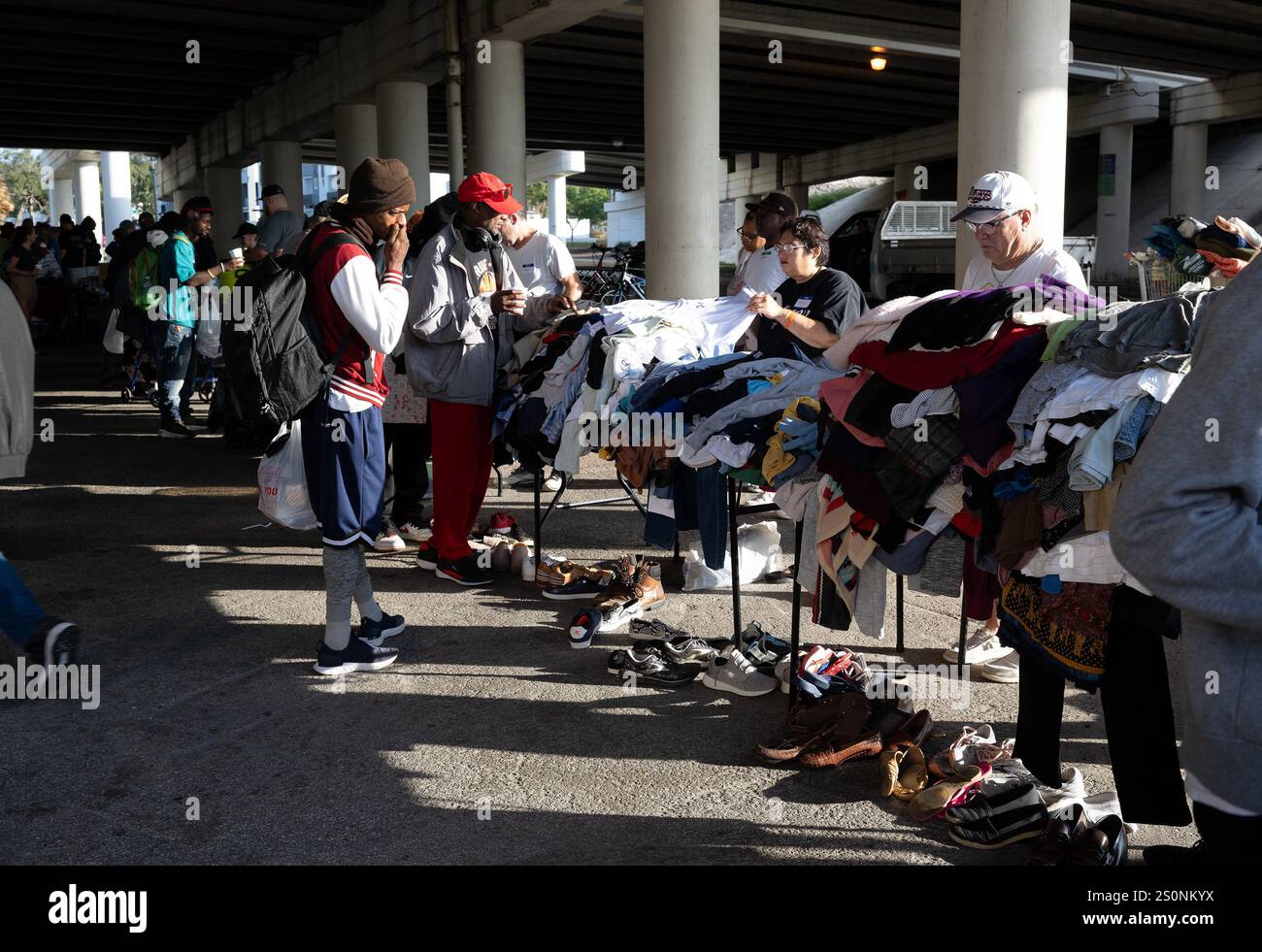 Tampa, Florida, USA. 28th Dec, 2024. Homeless men and women gather ...