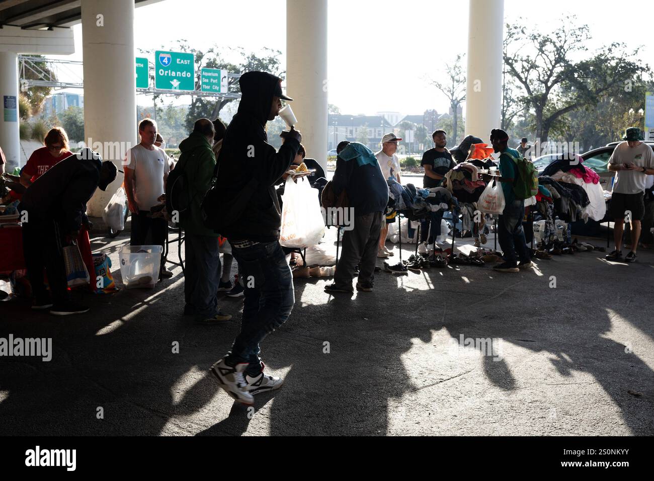 Tampa, Florida, USA. 28th Dec, 2024. Homeless men and women gather ...