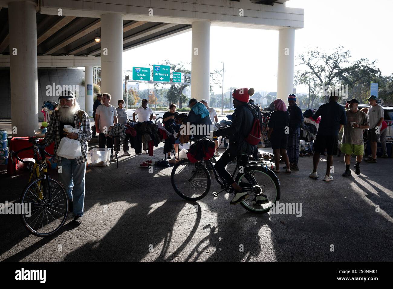 Tampa, Florida, USA. 28th Dec, 2024. Homeless men and women gather ...