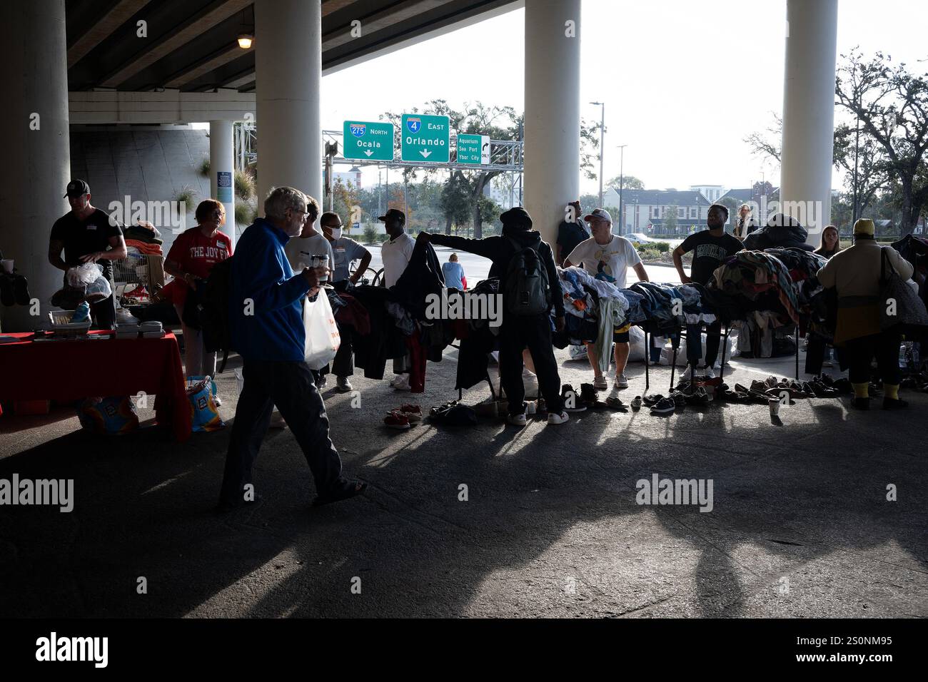 Tampa, Florida, USA. 28th Dec, 2024. Homeless men and women gather ...