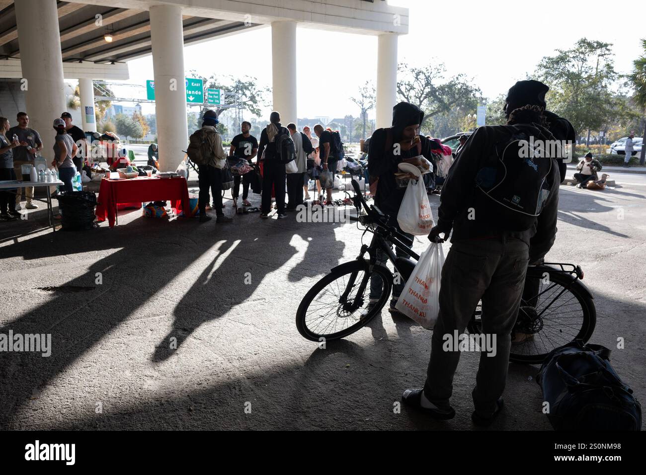 Tampa, Florida, USA. 28th Dec, 2024. Homeless men and women gather ...