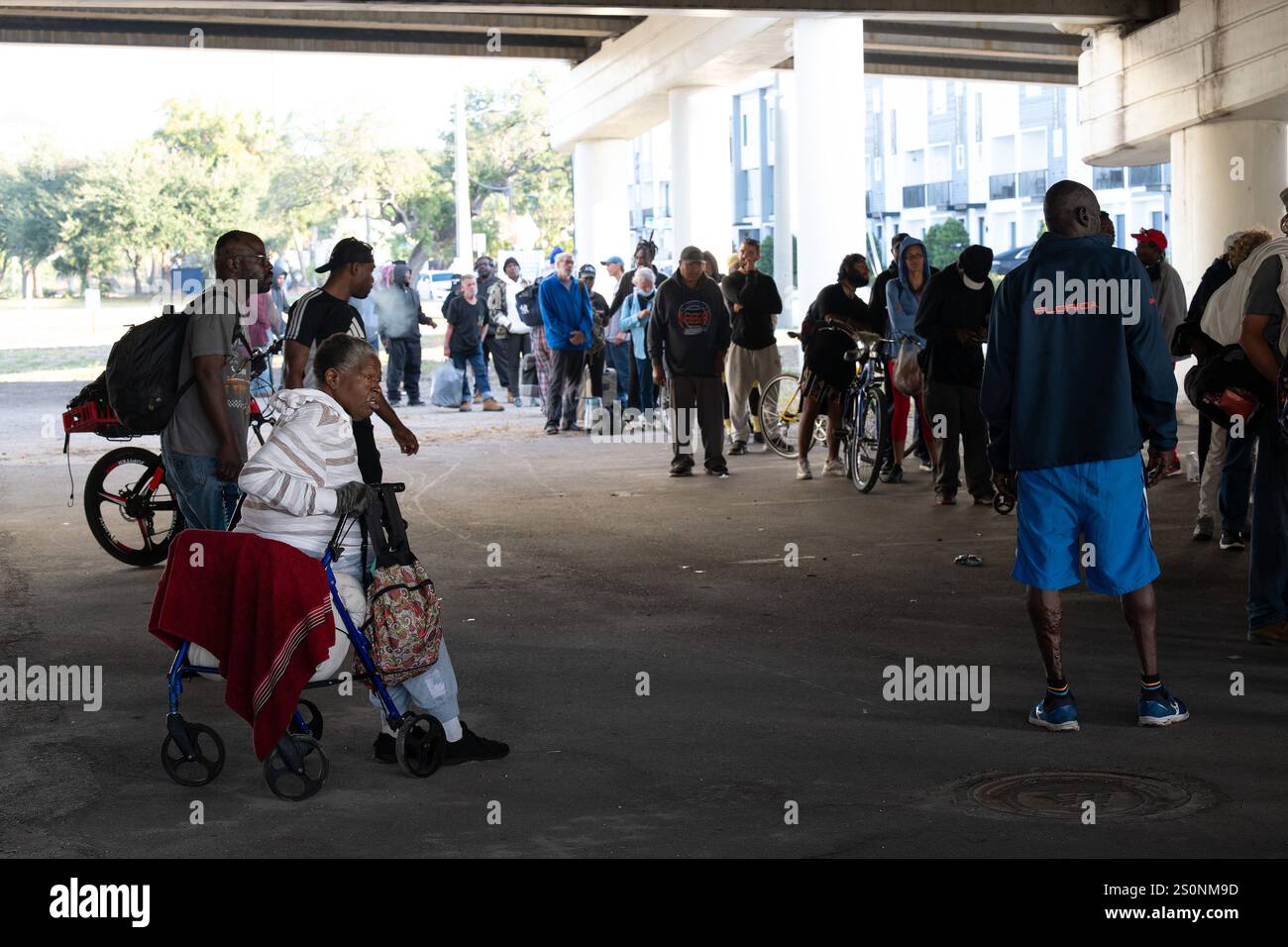 Tampa, Florida, USA. 28th Dec, 2024. Homeless men and women gather ...