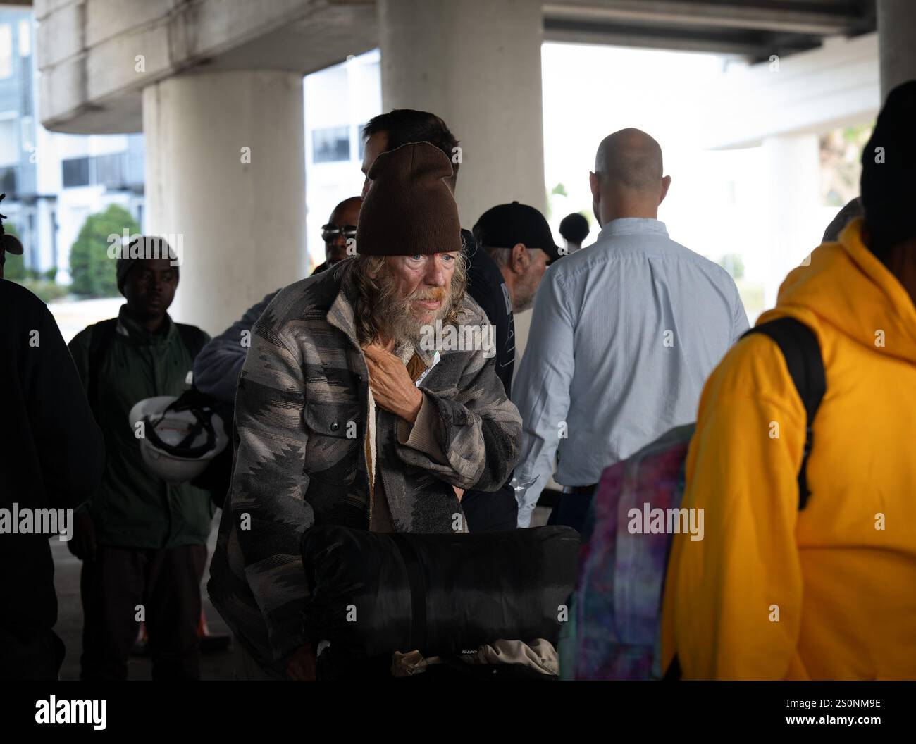 Tampa, Florida, USA. 28th Dec, 2024. A homeless man waits for a hot ...
