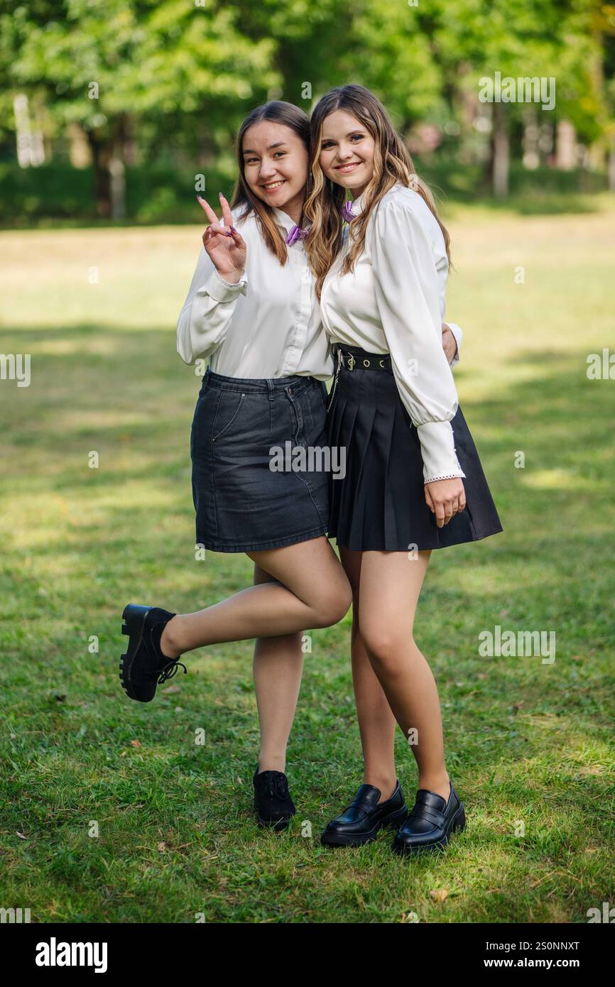 Two joyful students embracing and celebrating their return to school ...