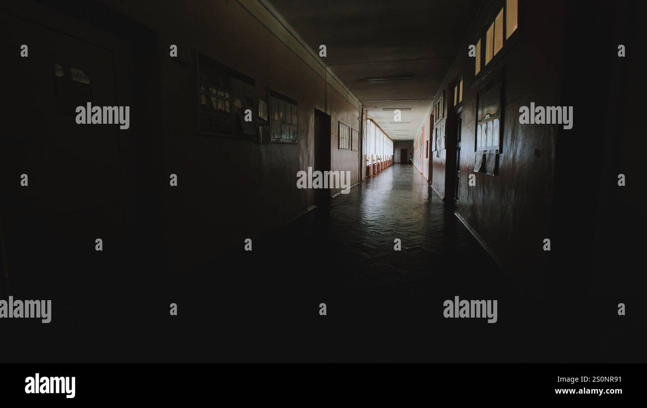 Dimly lit school hallway after the last school day, evoking a sense of ...