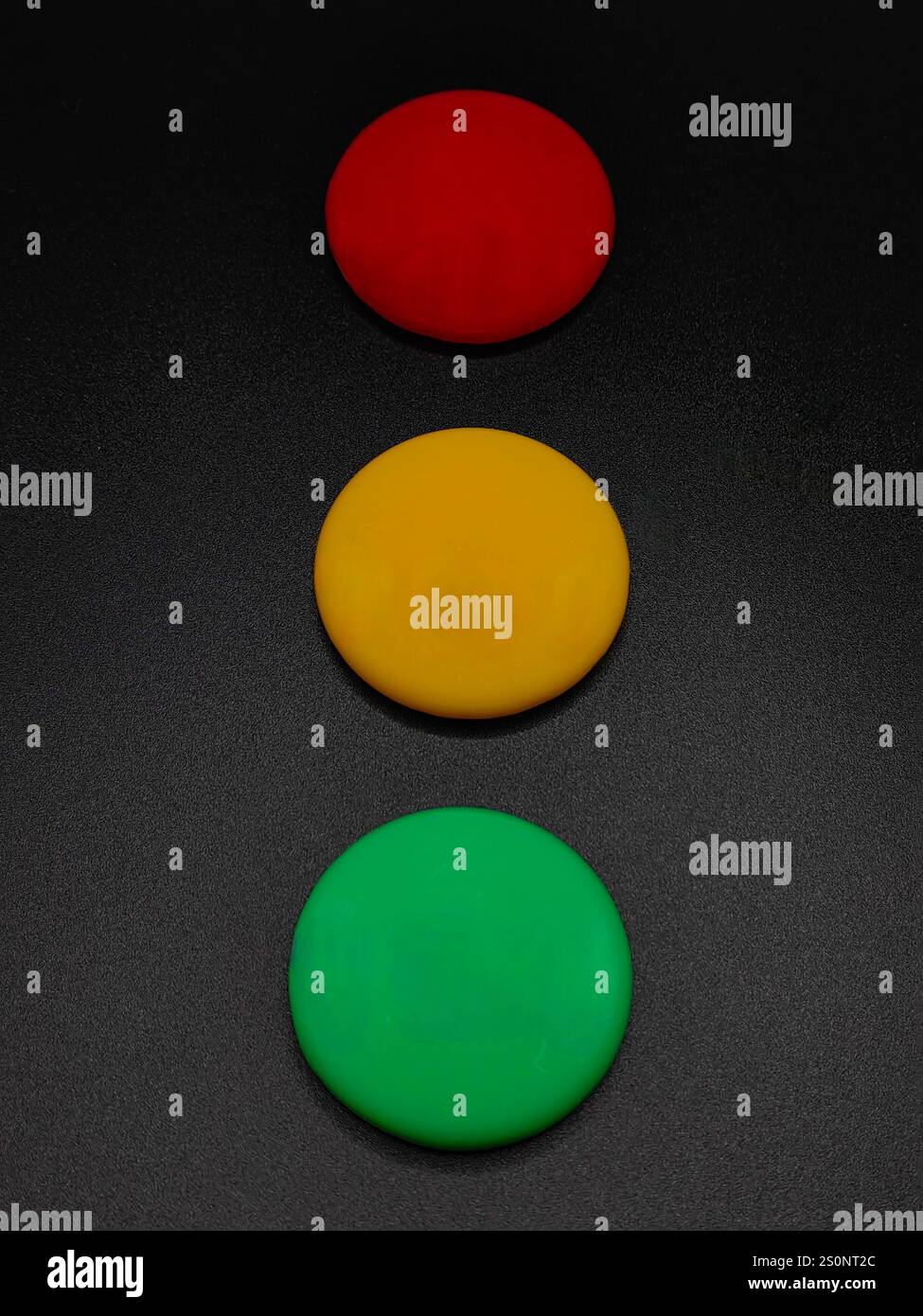 Traffic Lights Concept: Magnet Buttons Isolated on Black Paper - Ready ...