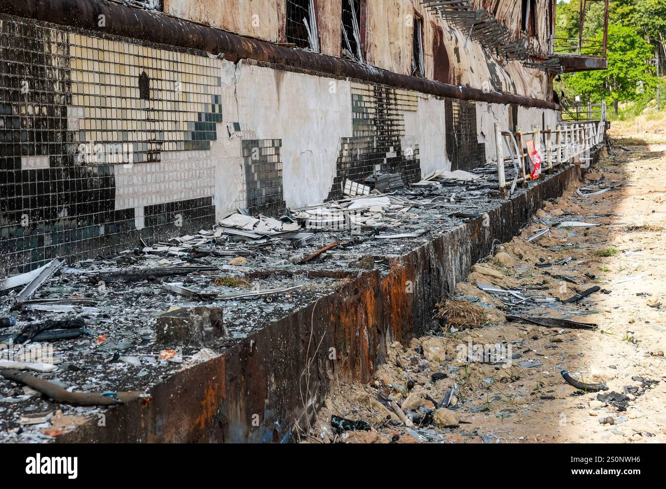 A view of various debris, with a lot of broken window glasses, after ...
