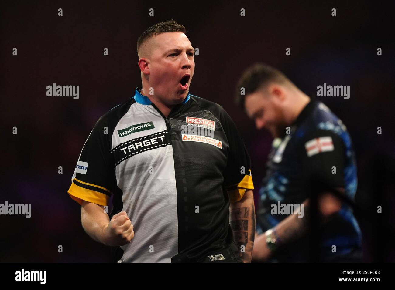 Chris Dobey celebrates after winning his third round match against Josh ...