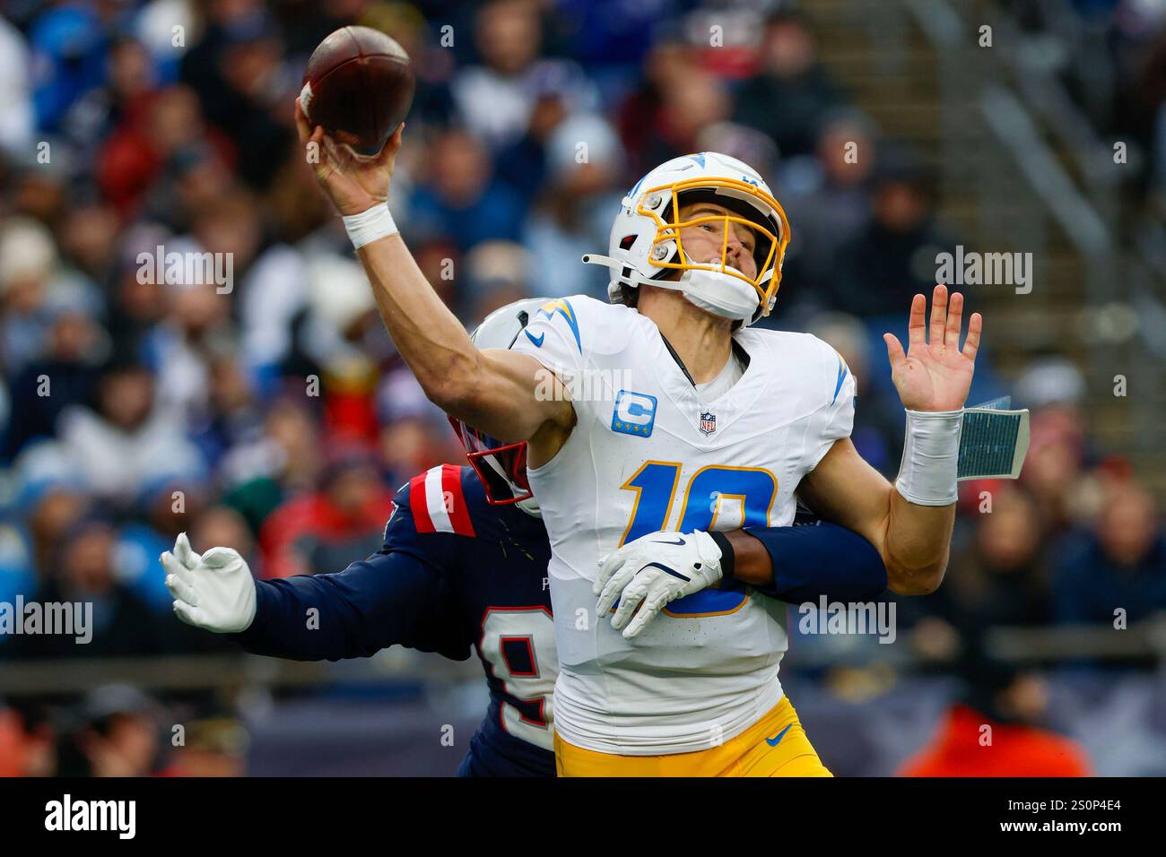 New England Patriots defensive end Keion White (99) wraps up Los ...