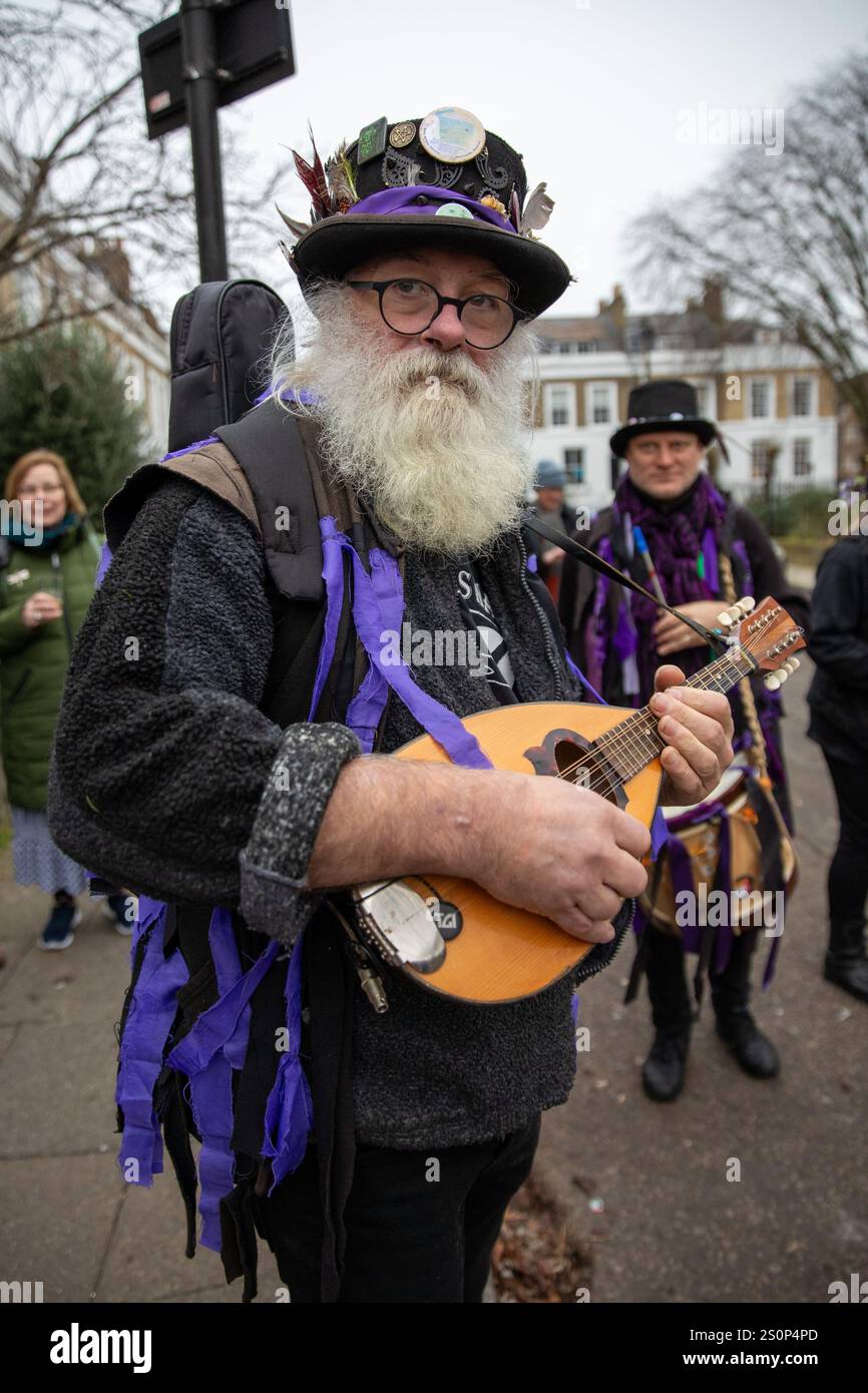 A musician plays a traditional English instrument. Several different ...