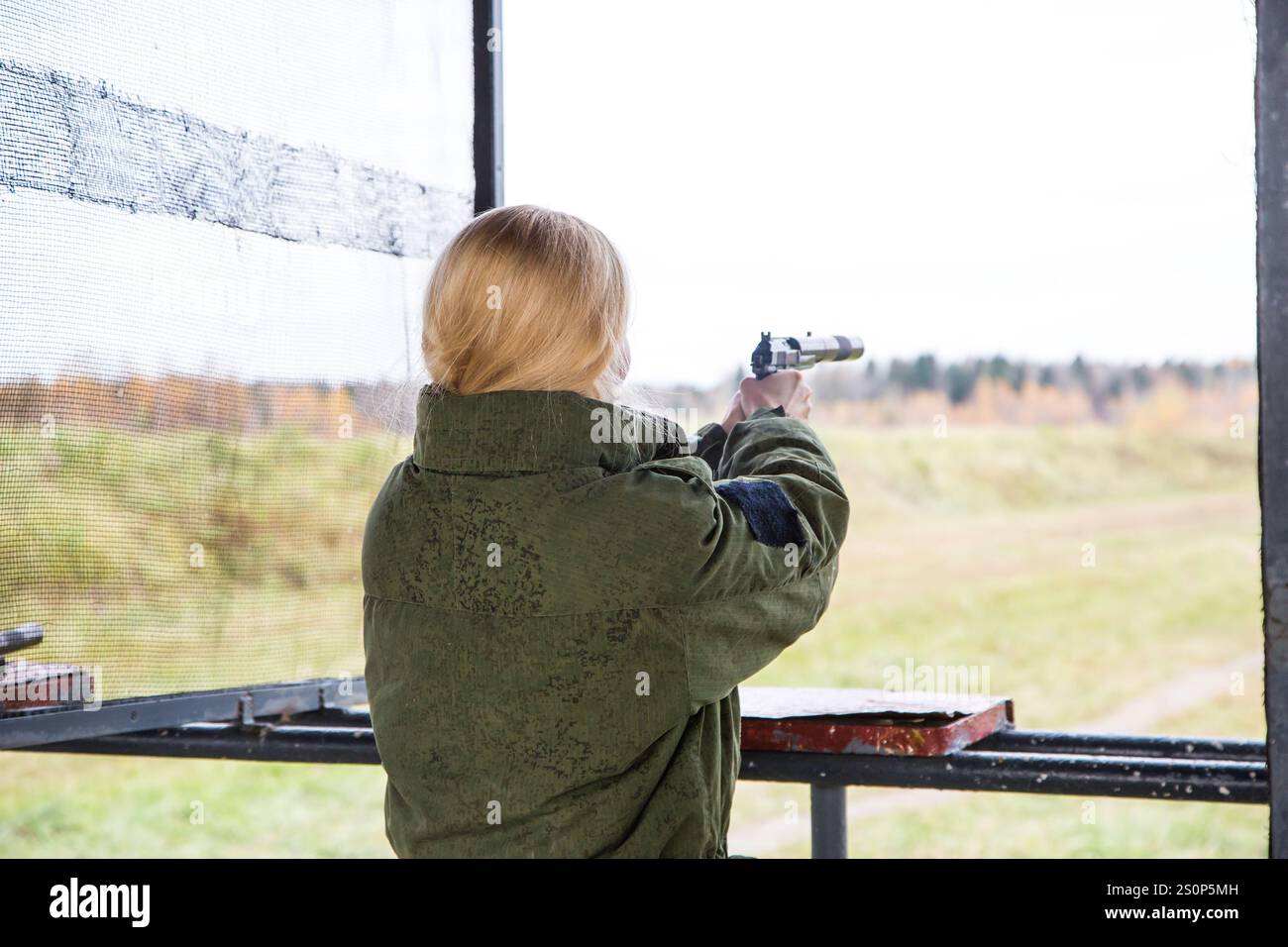 Man shooting at a target. Unformal shooting range . High quality photo ...