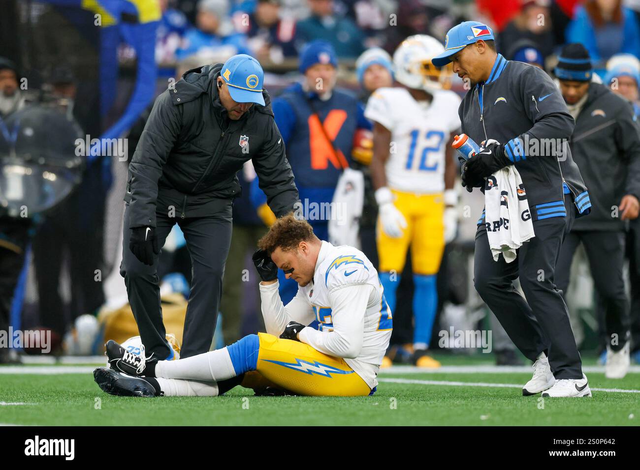 Los Angeles Chargers cornerback Elijah Molden (22) is tended to by ...