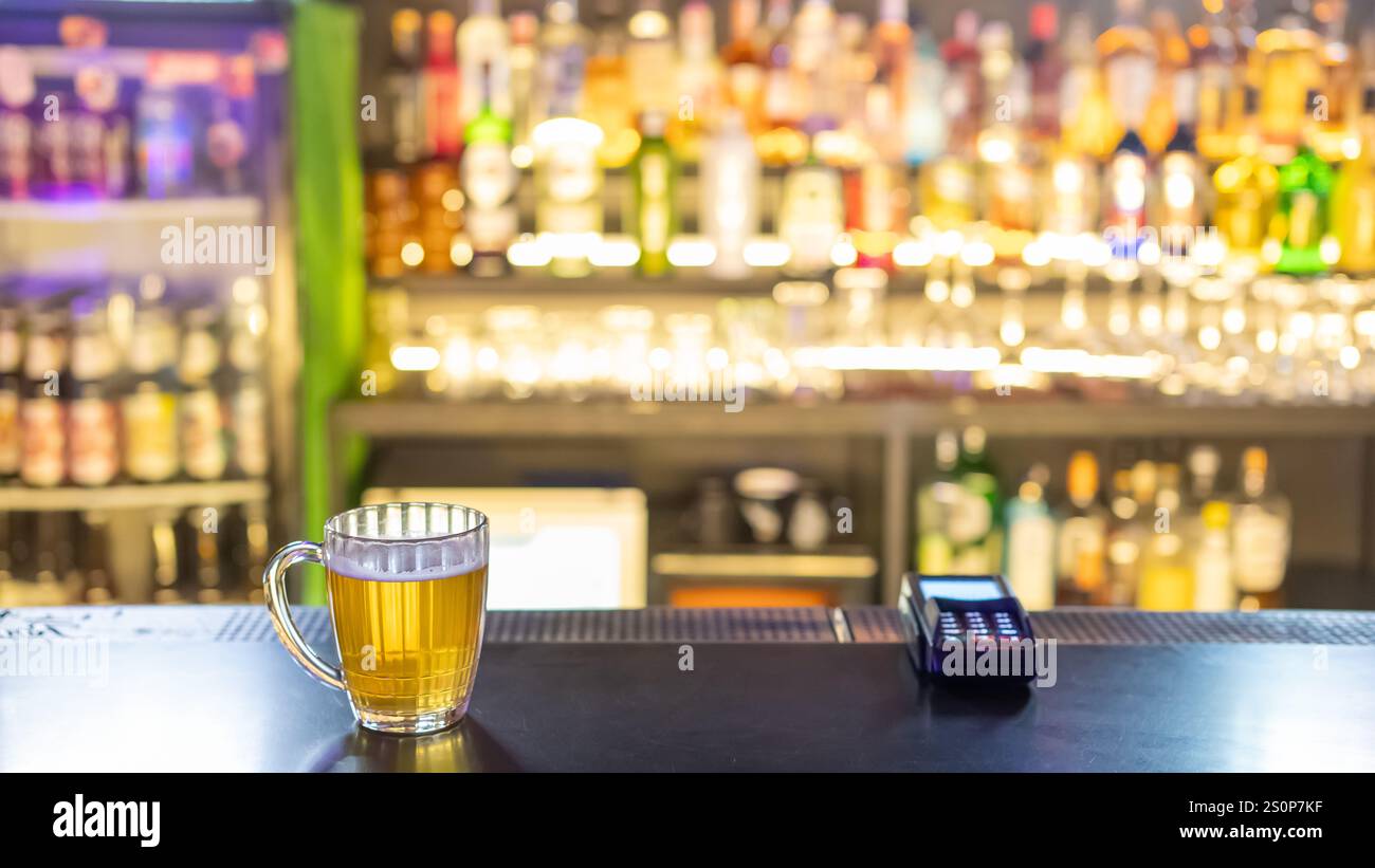 A mug of beer on the bar counter in a pub Stock Photo - Alamy