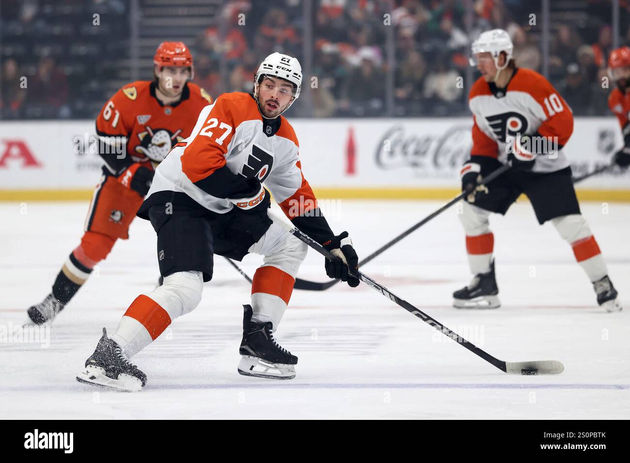 Philadelphia Flyers left wing Noah Cates (27) controls the puck against ...