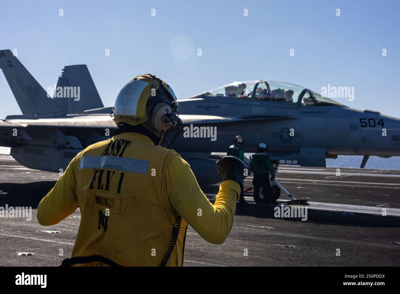 Red Sea, International Waters. 23 December, 2024. U.S Navy sailors ready a E/A-18G Growler ...