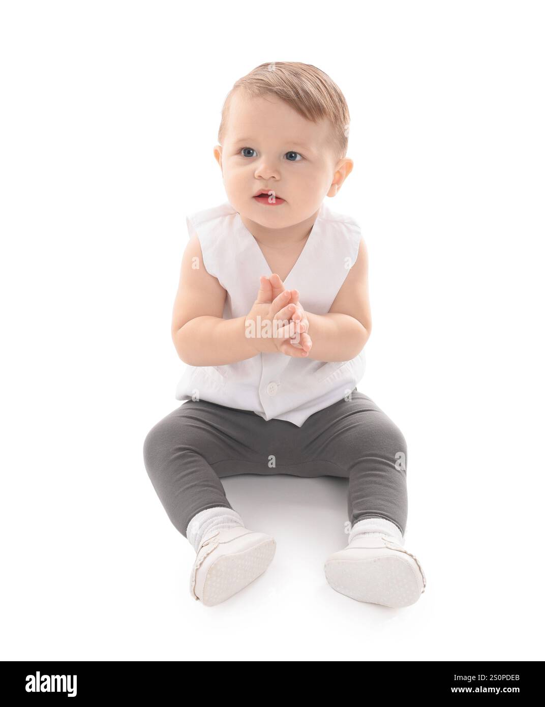 Cute little baby sitting on white background Stock Photo - Alamy