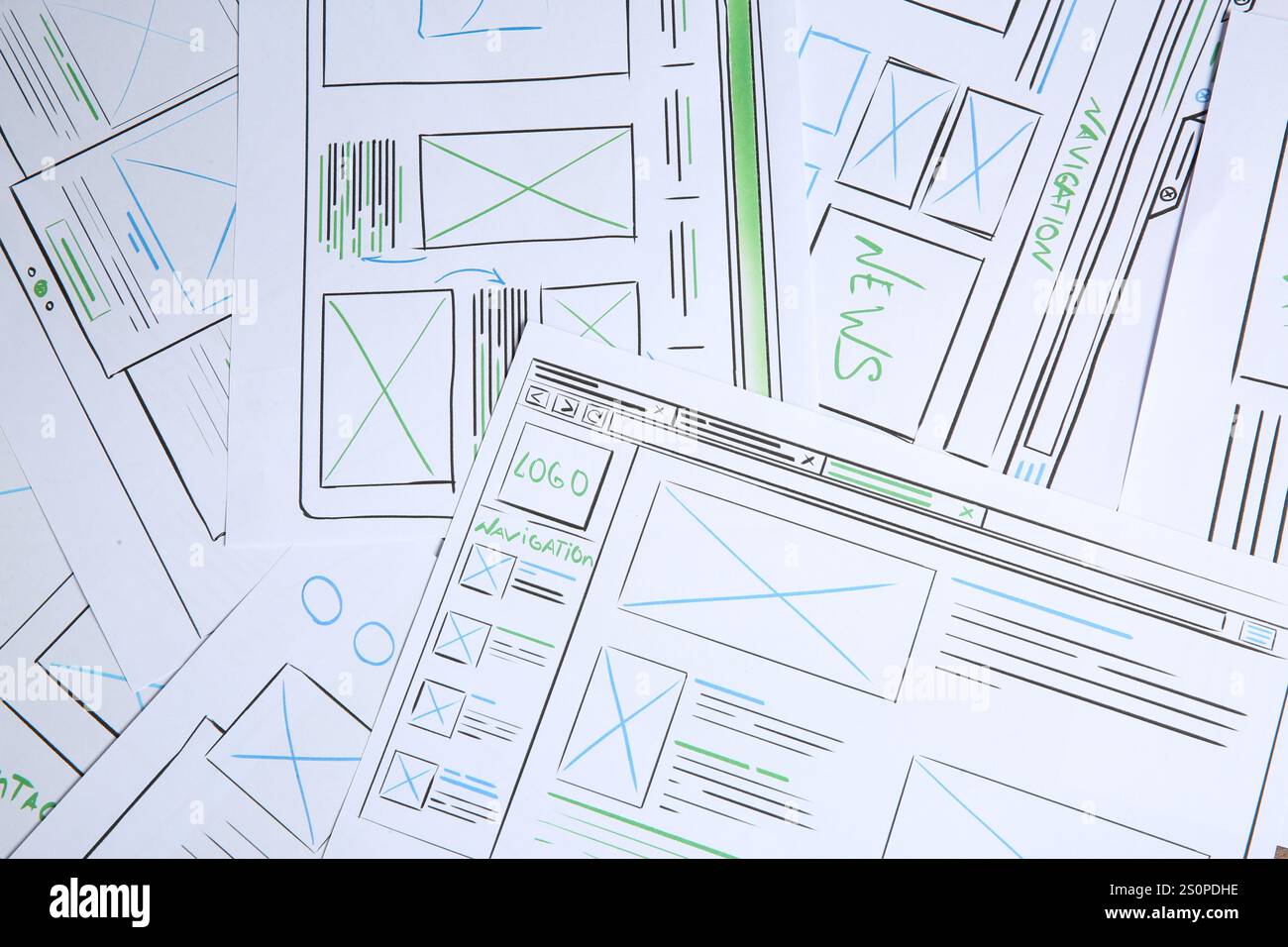 Developing UI design. Sketches of website wireframes as background, top ...