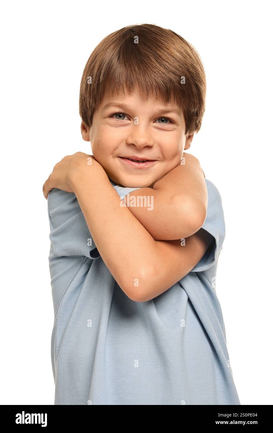 Cute little boy hugging himself on white background Stock Photo - Alamy