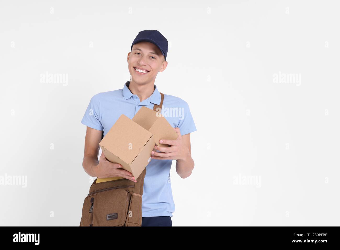 Happy postman with bag and parcels on white background Stock Photo - Alamy