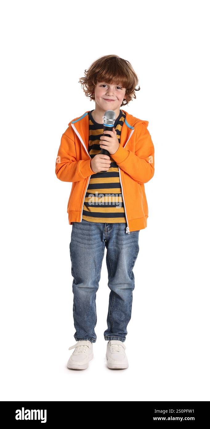 Little boy with microphone on white background Stock Photo - Alamy