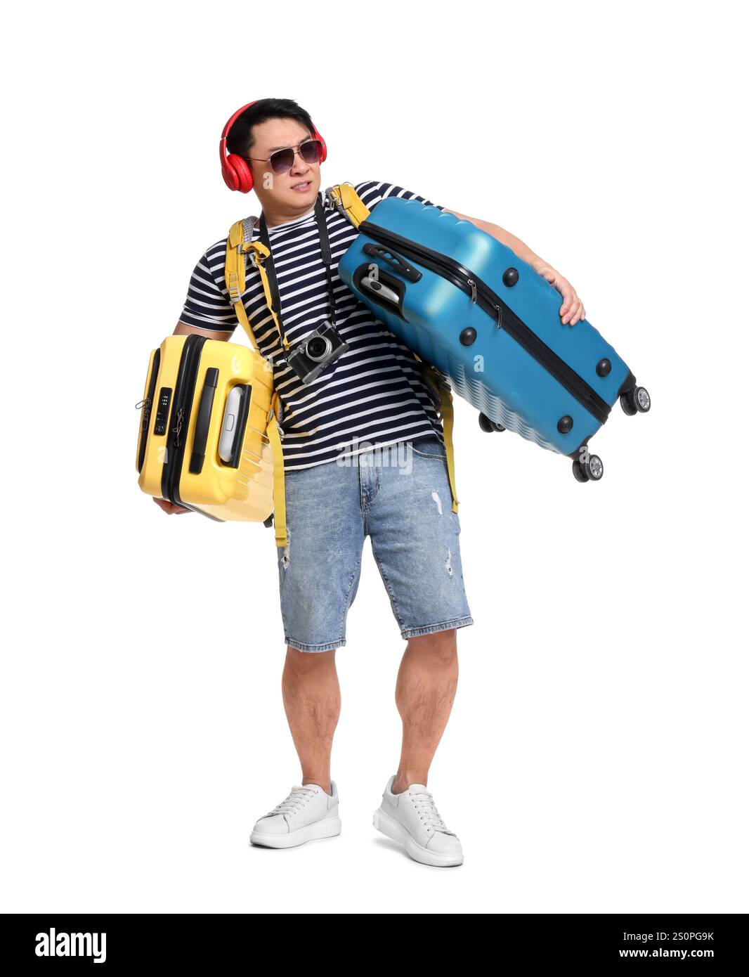 Traveller carrying heavy suitcases on white background Stock Photo - Alamy