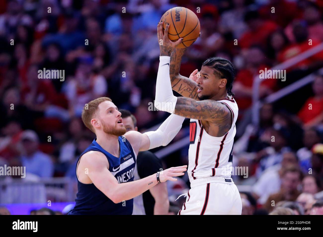 Houston Rockets guard Jalen Green, right, looks to pass the ball over ...