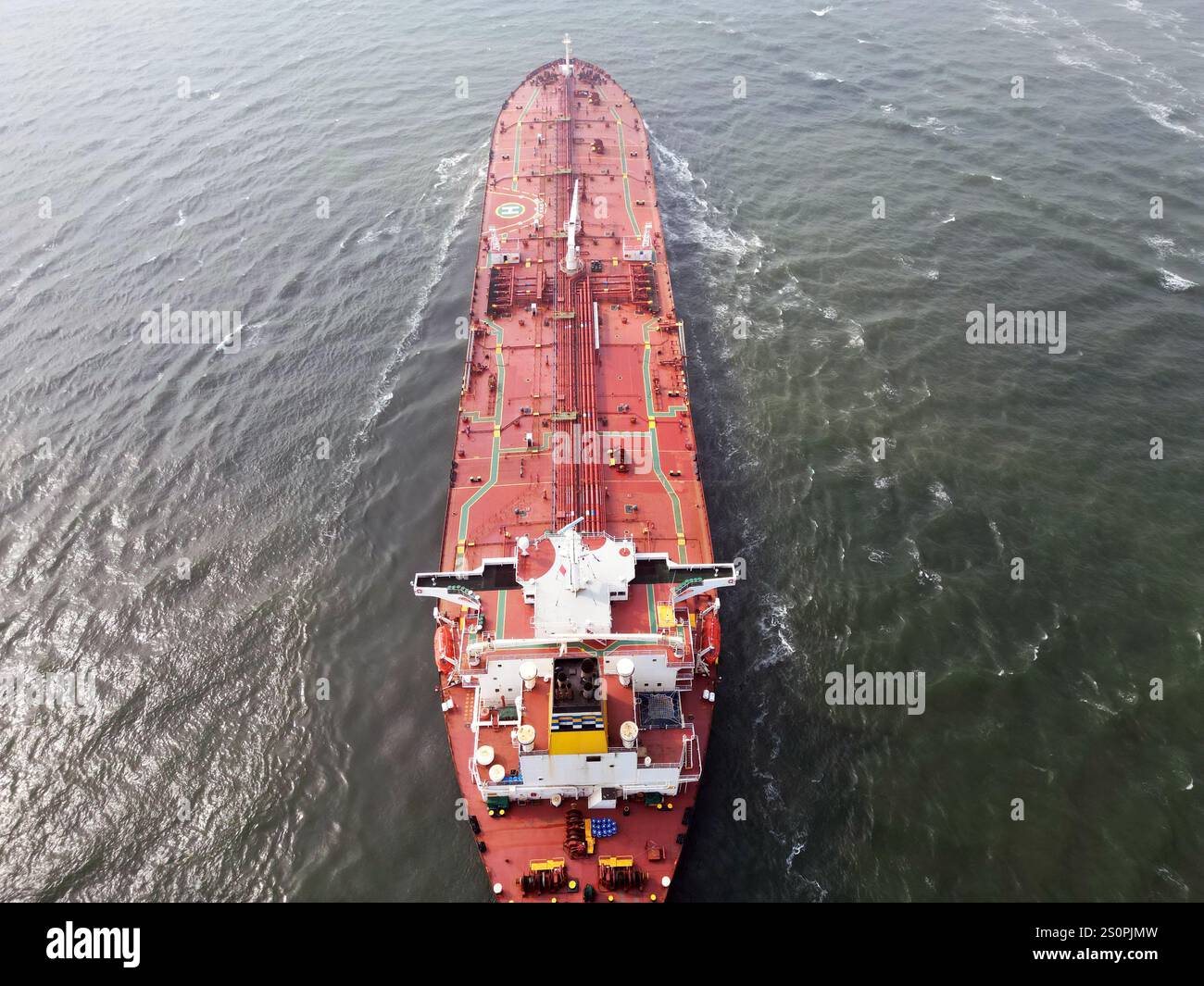 Aerial view of a large oil tanker approaching the port of Rotterdam ...