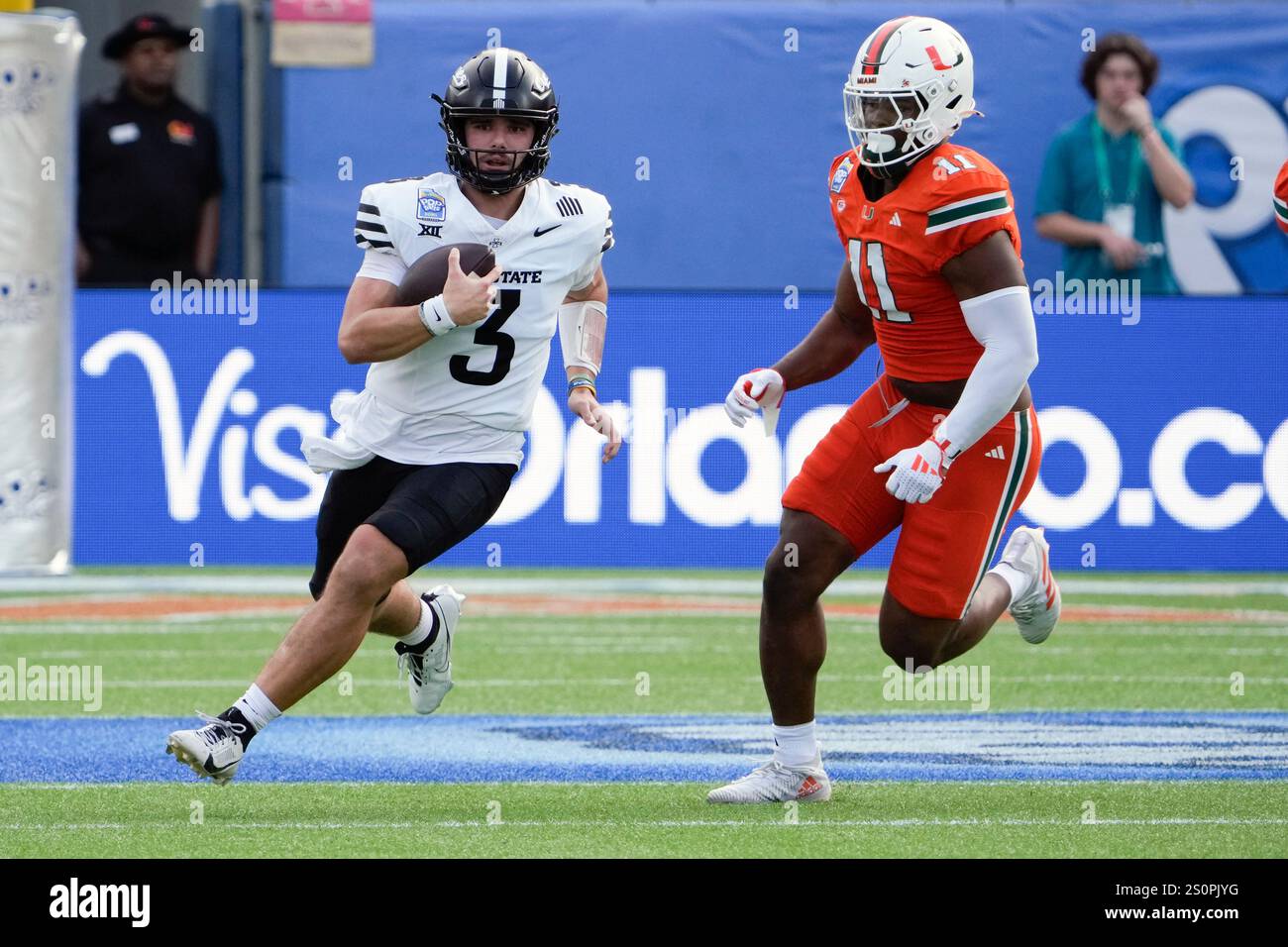 Iowa State quarterback Rocco Becht (3) scrambles past Miami defensive ...