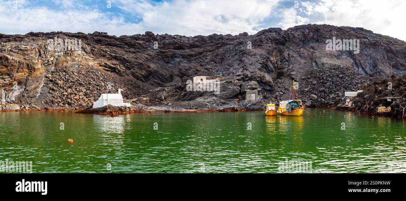 Scenic Coastal Lagoon With Ferries Docked Against Volcanic Rock ...