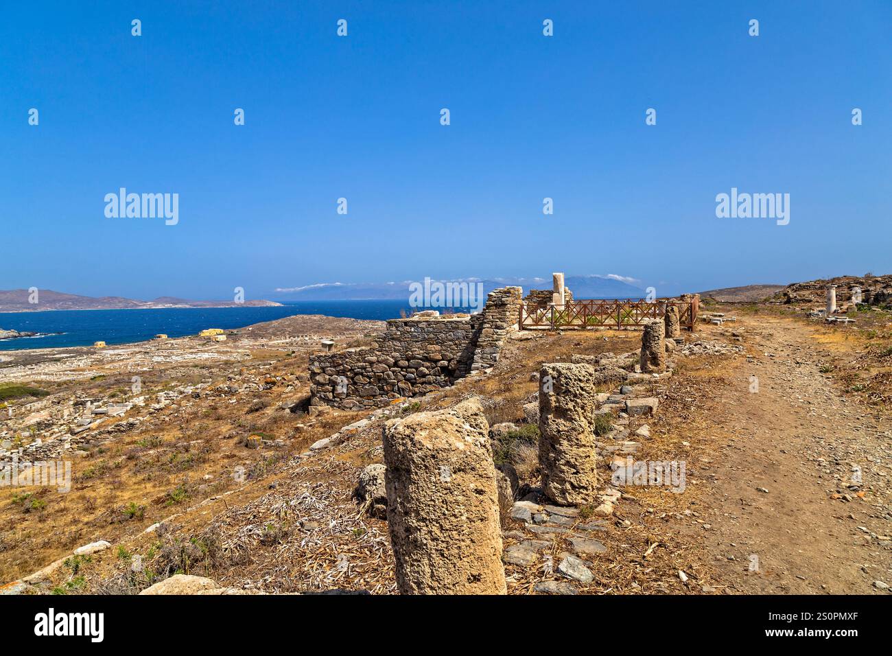 Ancient Ruins Under a Clear Sky Depicting Historical Stone Architecture ...