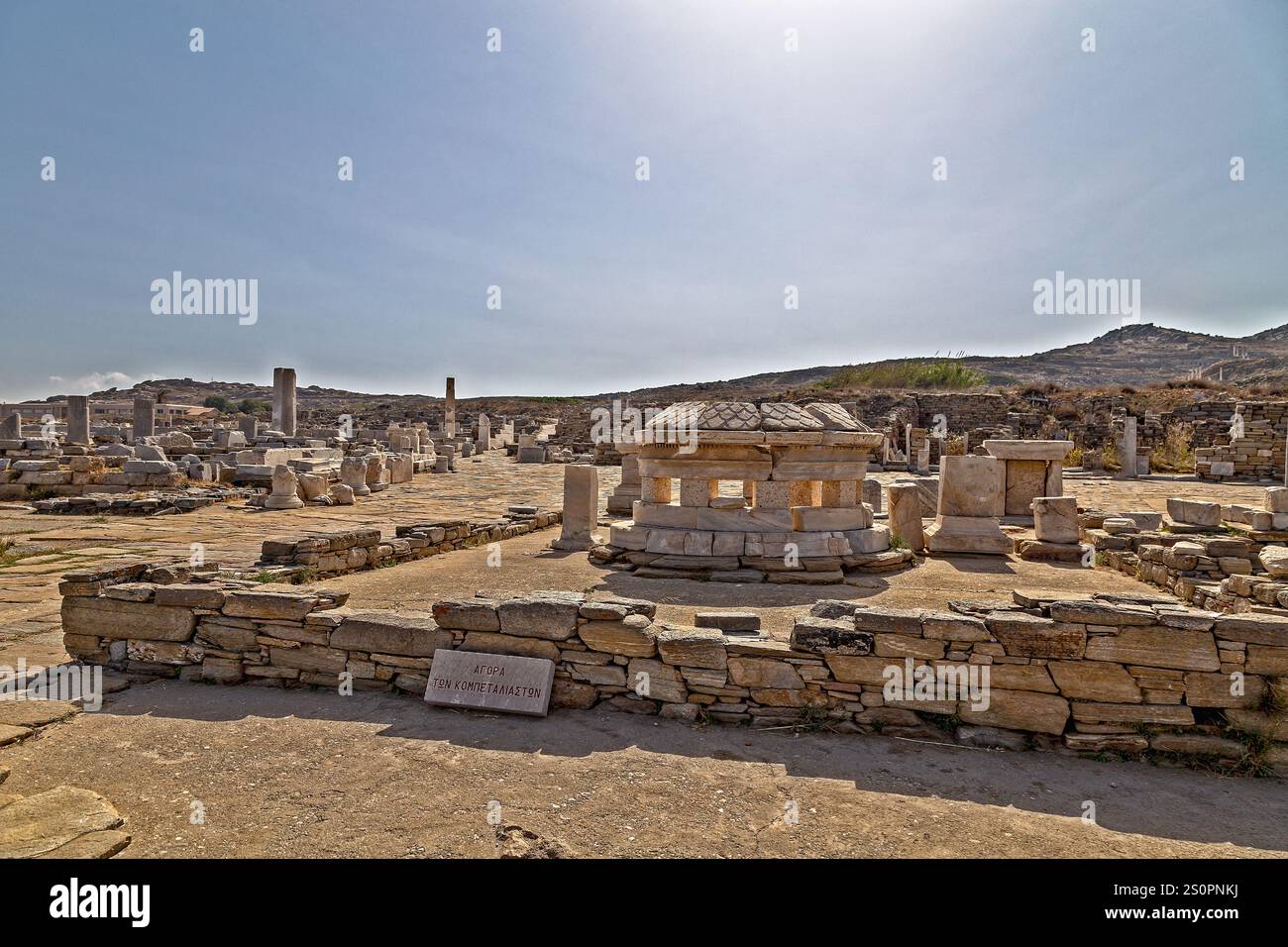 Ancient Ruins Under a Clear Sky Depicting Historical Stone Architecture ...